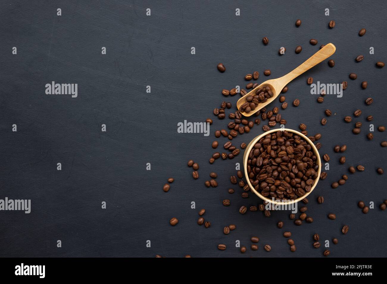 coffee beans on old black wooden table background. mockup and templates ...
