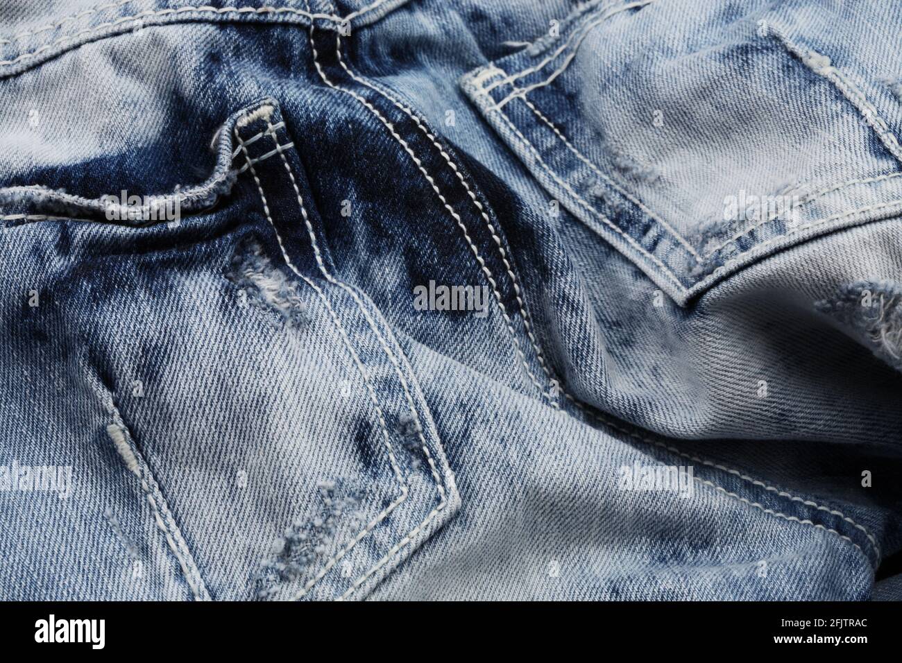 Modern jeans with special faded wash and stain treatment Stock Photo ...