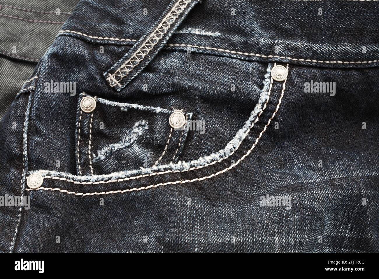 Modern jeans with special faded wash and torn treatment Stock Photo - Alamy
