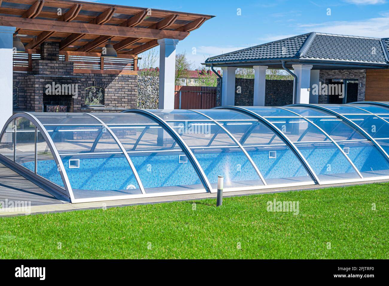 Indoor private outdoor pool. glass covered pool with water indoor ...