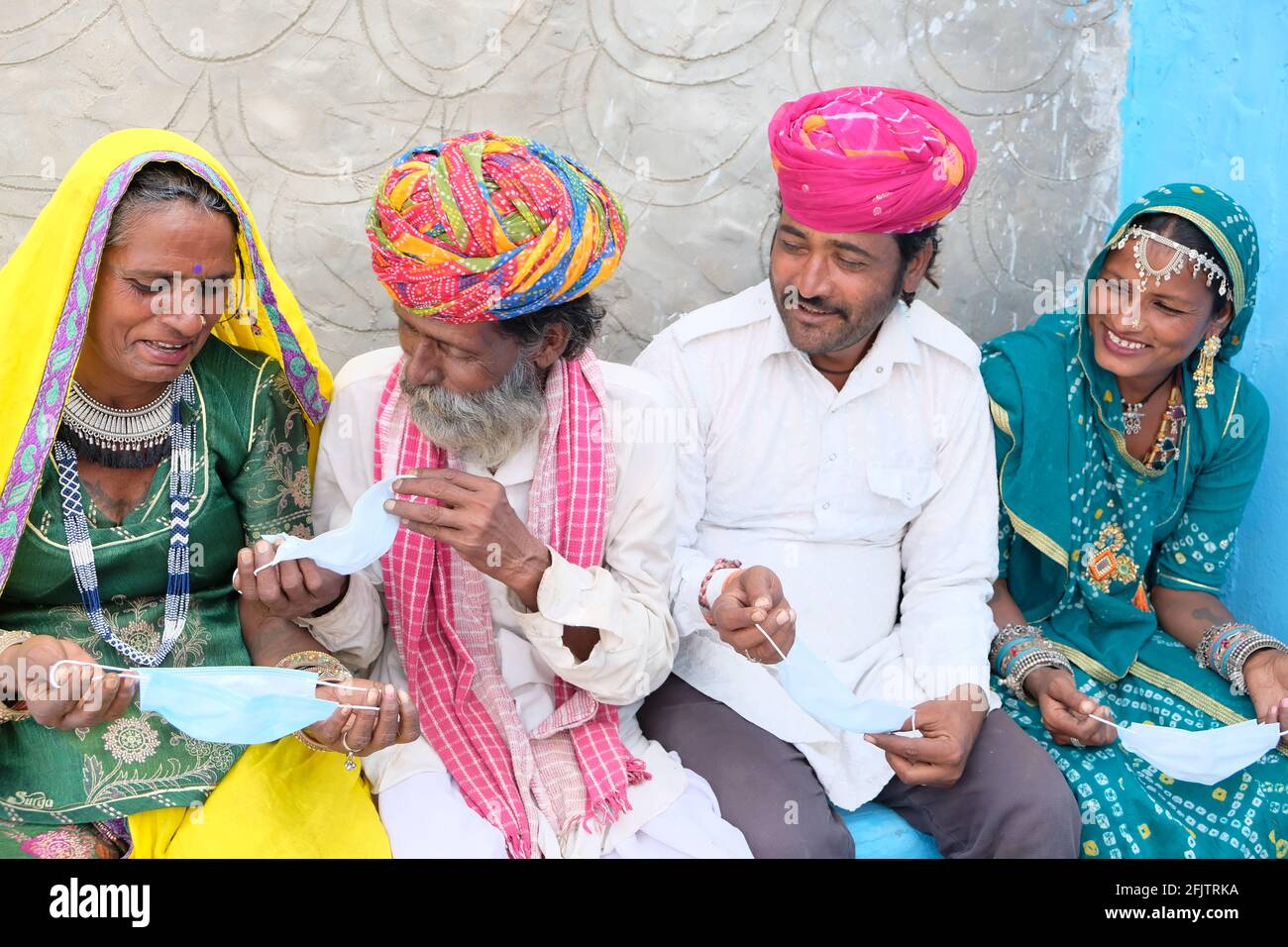 Group of Indian people in national costumes wearing face masks during ...