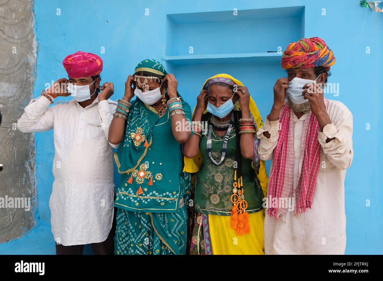 Group of Indian people in national costumes wearing face masks during ...