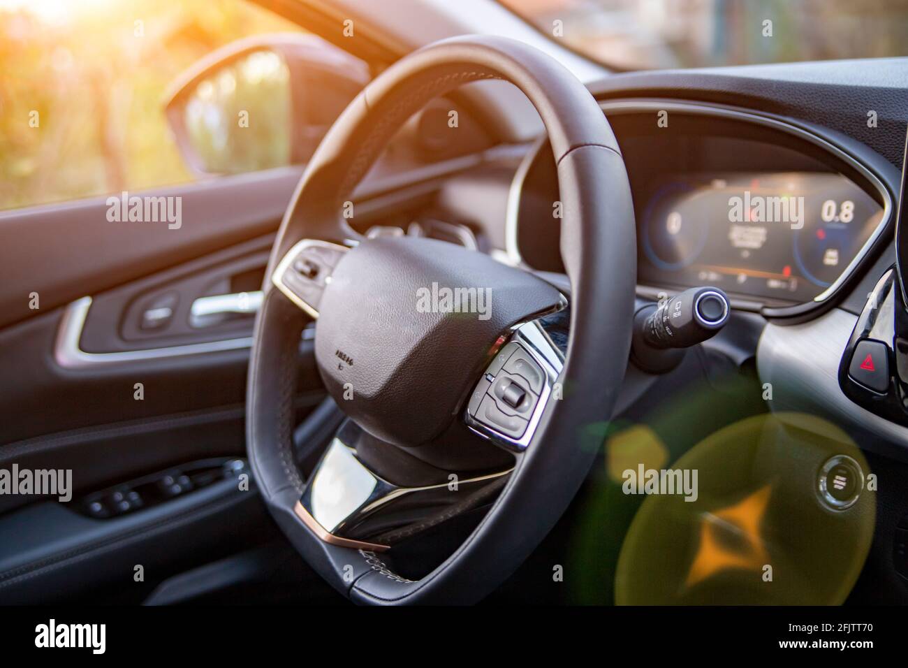 empty interior of modern premium car dark interior close-up steering ...