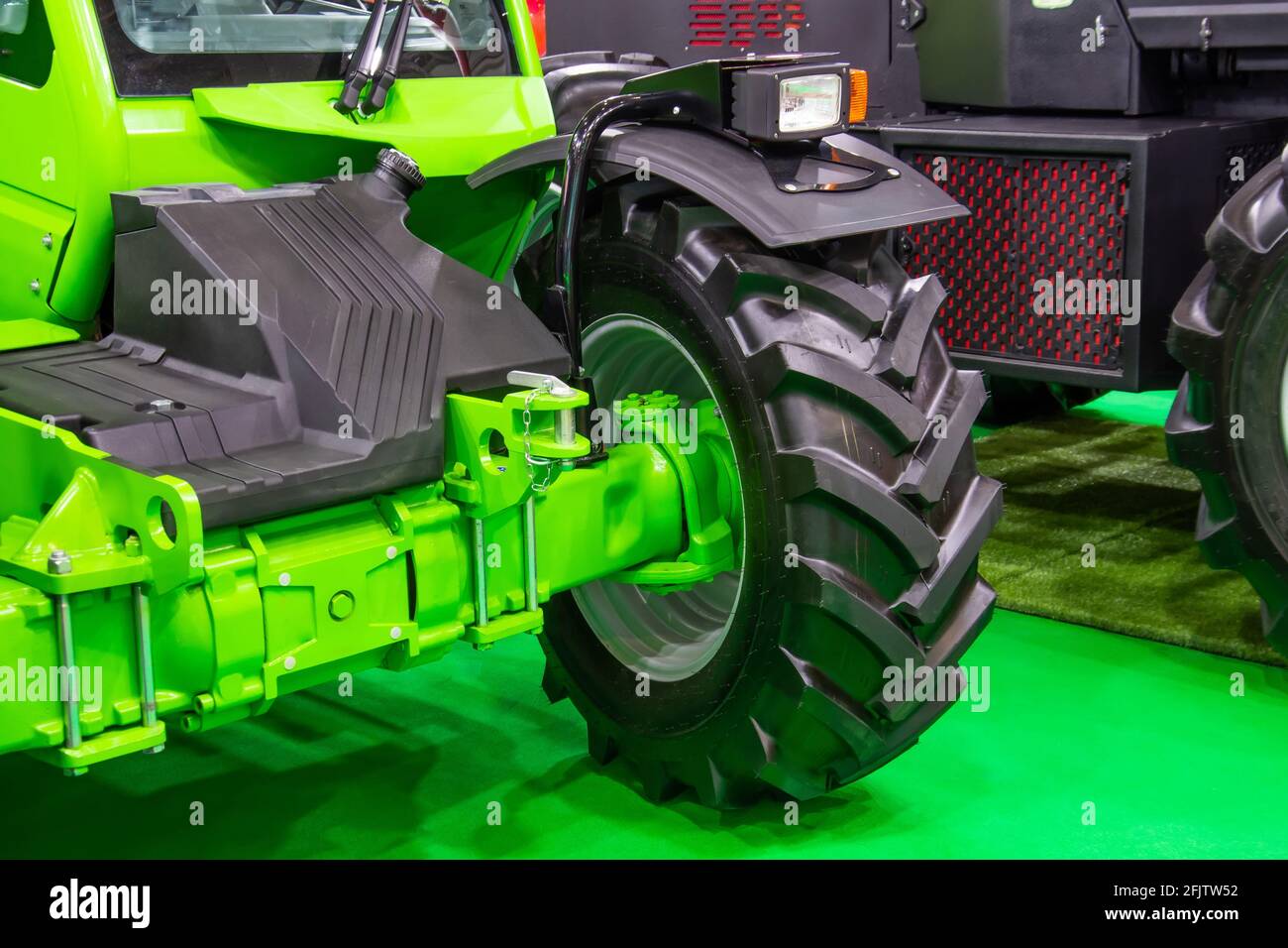 Wheel of a new tractor, front axle view Stock Photo - Alamy