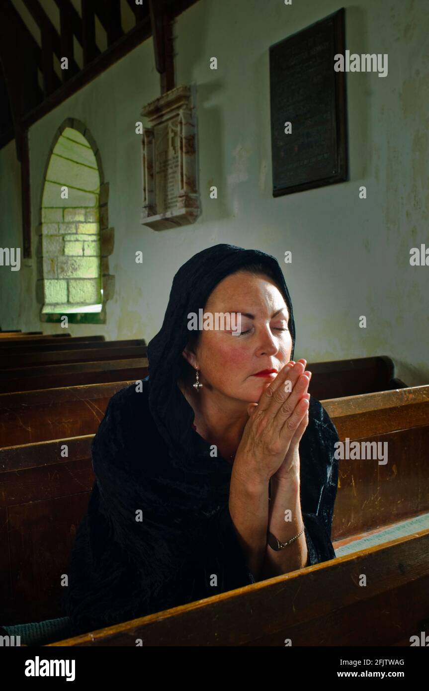 Woman Praying Inside Church High Resolution Stock Photography and ...