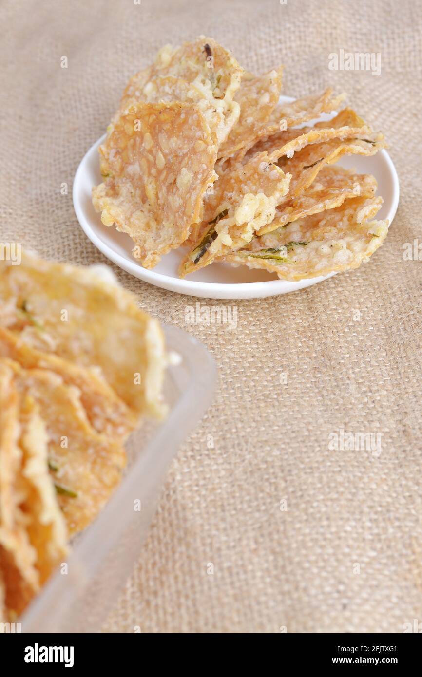 Keripik tempe , tempeh crackers in a plate. Indonesian traditional ...
