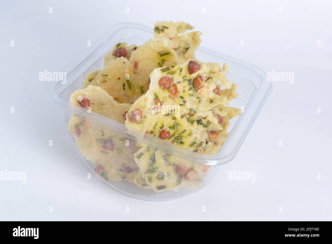 Peyek Kacang or peanut rempeyek in white background. Deep fried savoury ...