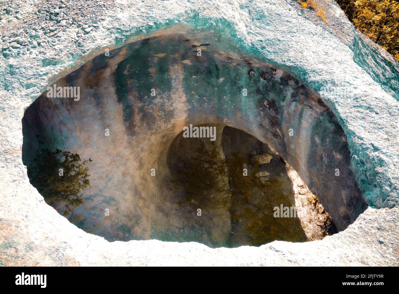 Rock City. Entrance to a man-made cave in a limestone rock. A place of ...