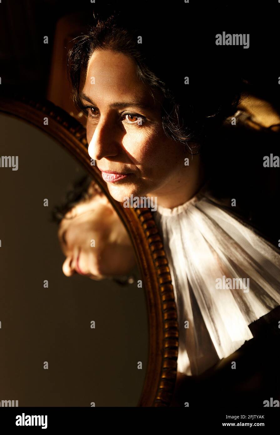woman´s face reflected in a mirror III Stock Photo - Alamy