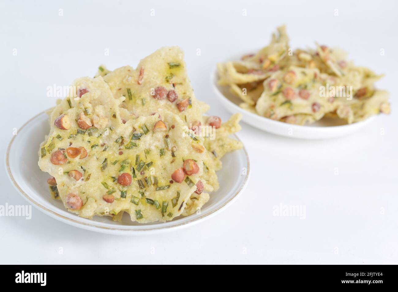 Peyek Kacang or peanut rempeyek in white background. Deep fried savoury ...