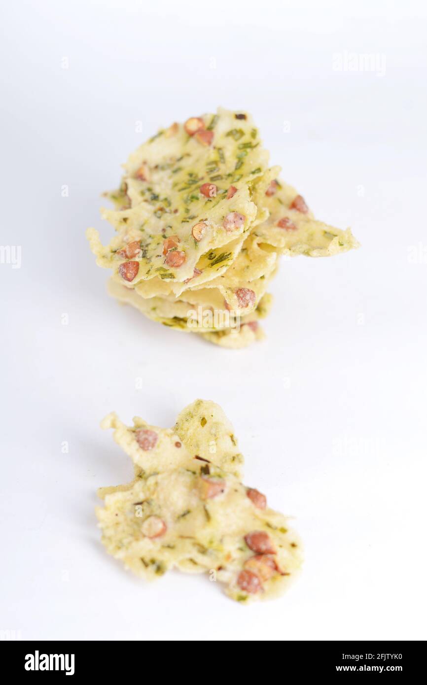 Peyek Kacang or peanut rempeyek in white background. Deep fried savoury ...