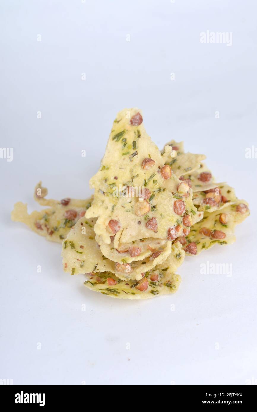 Peyek Kacang or peanut rempeyek in white background. Deep fried savoury ...