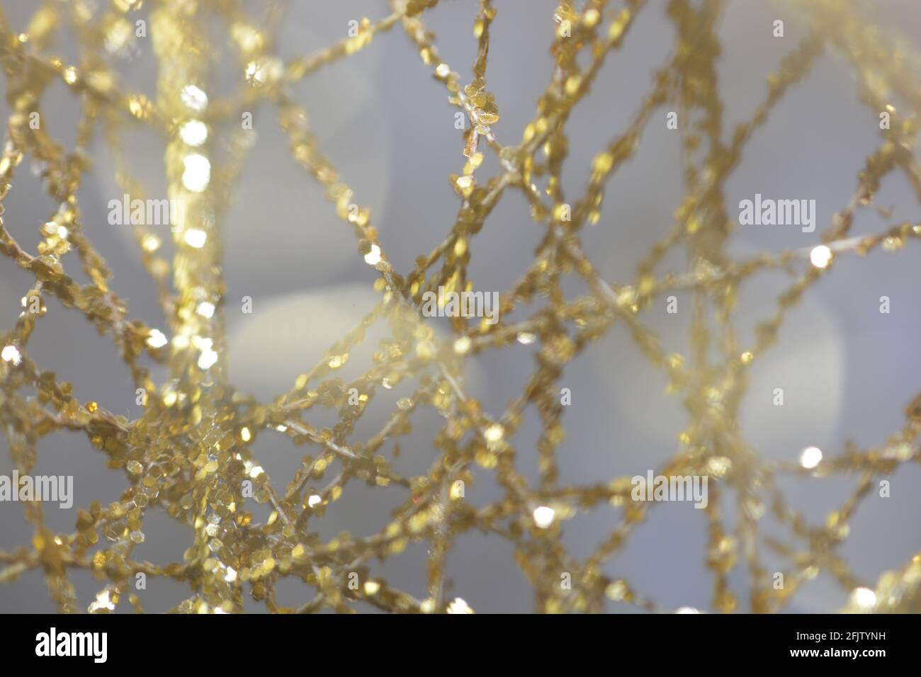 a close up view of golden wavy threads on a defocused background Stock ...