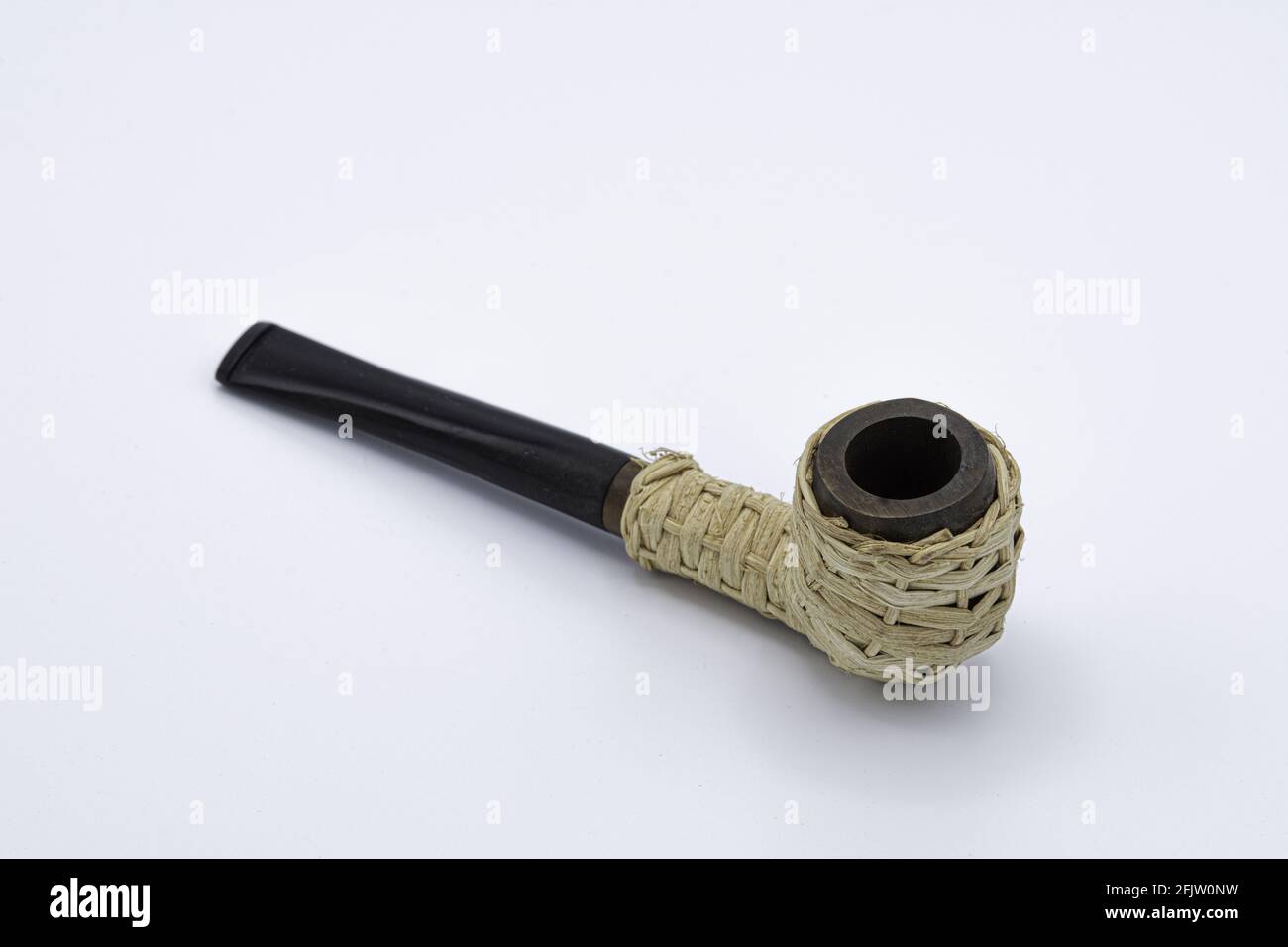 Closeup shot of an antique smoking pipe with weaving design isolated on ...