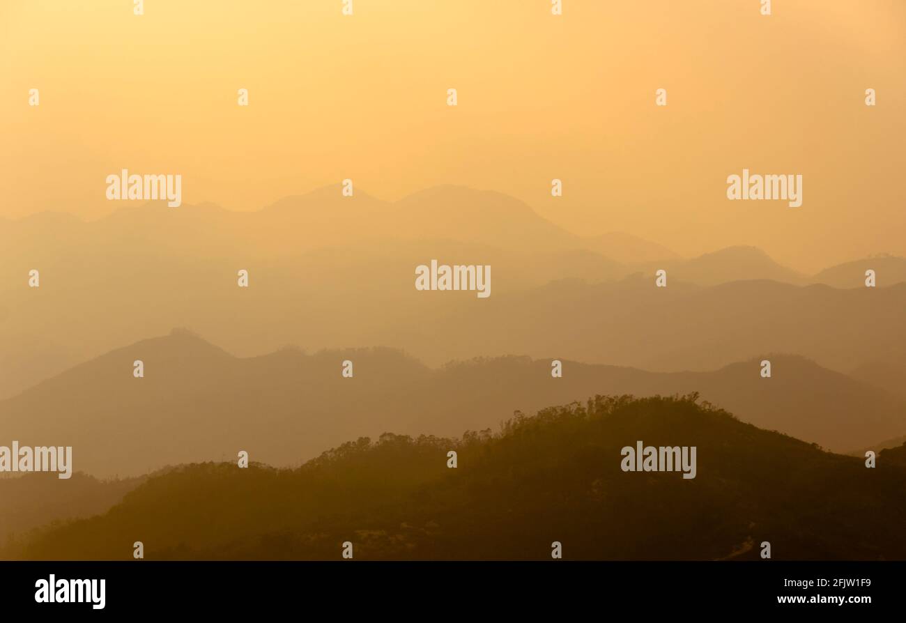 Layers of mountains hidden in mist in Hong Kong Stock Photo - Alamy