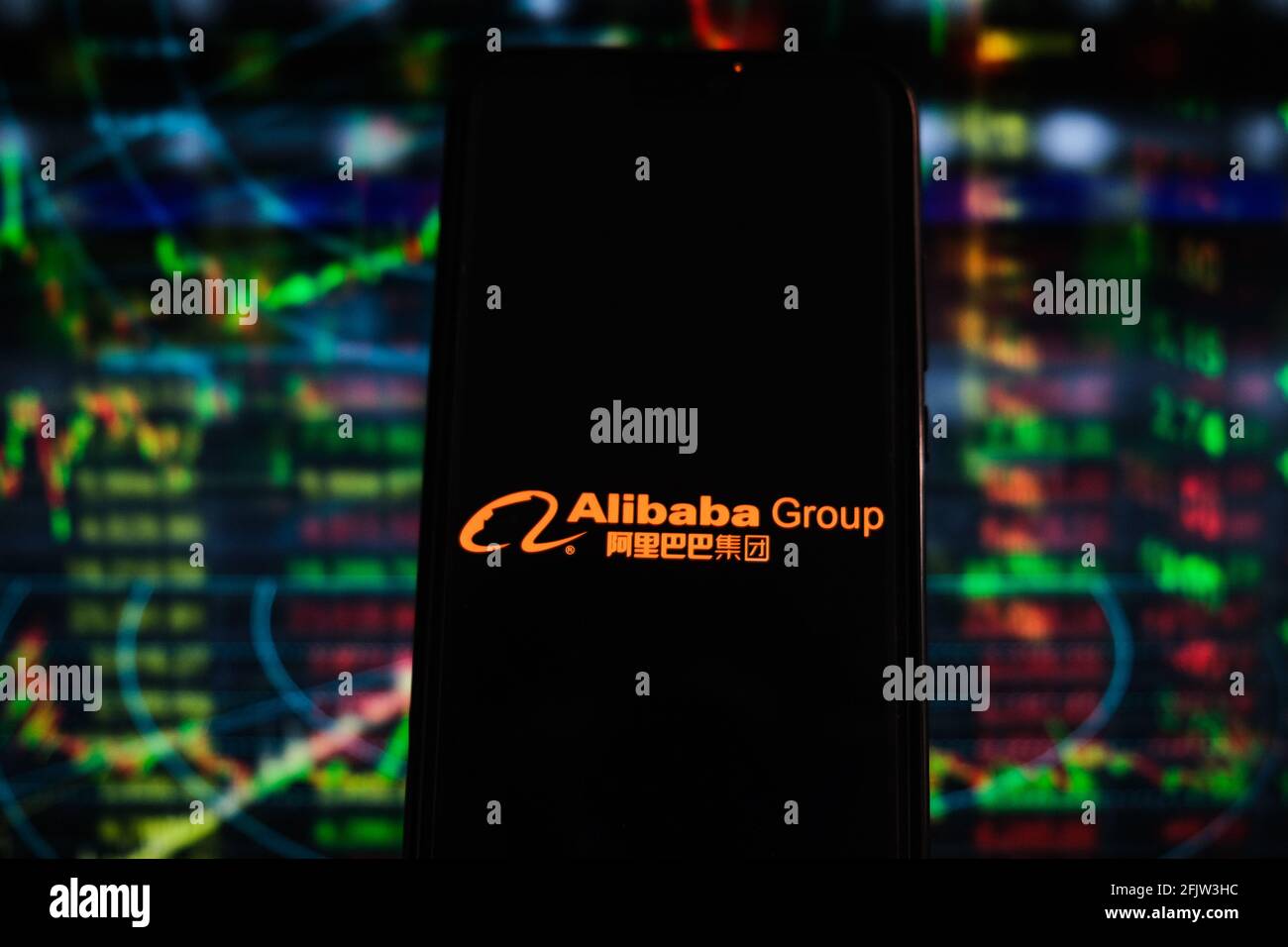 In this photo illustration an Alibaba Group logo seen displayed on a ...