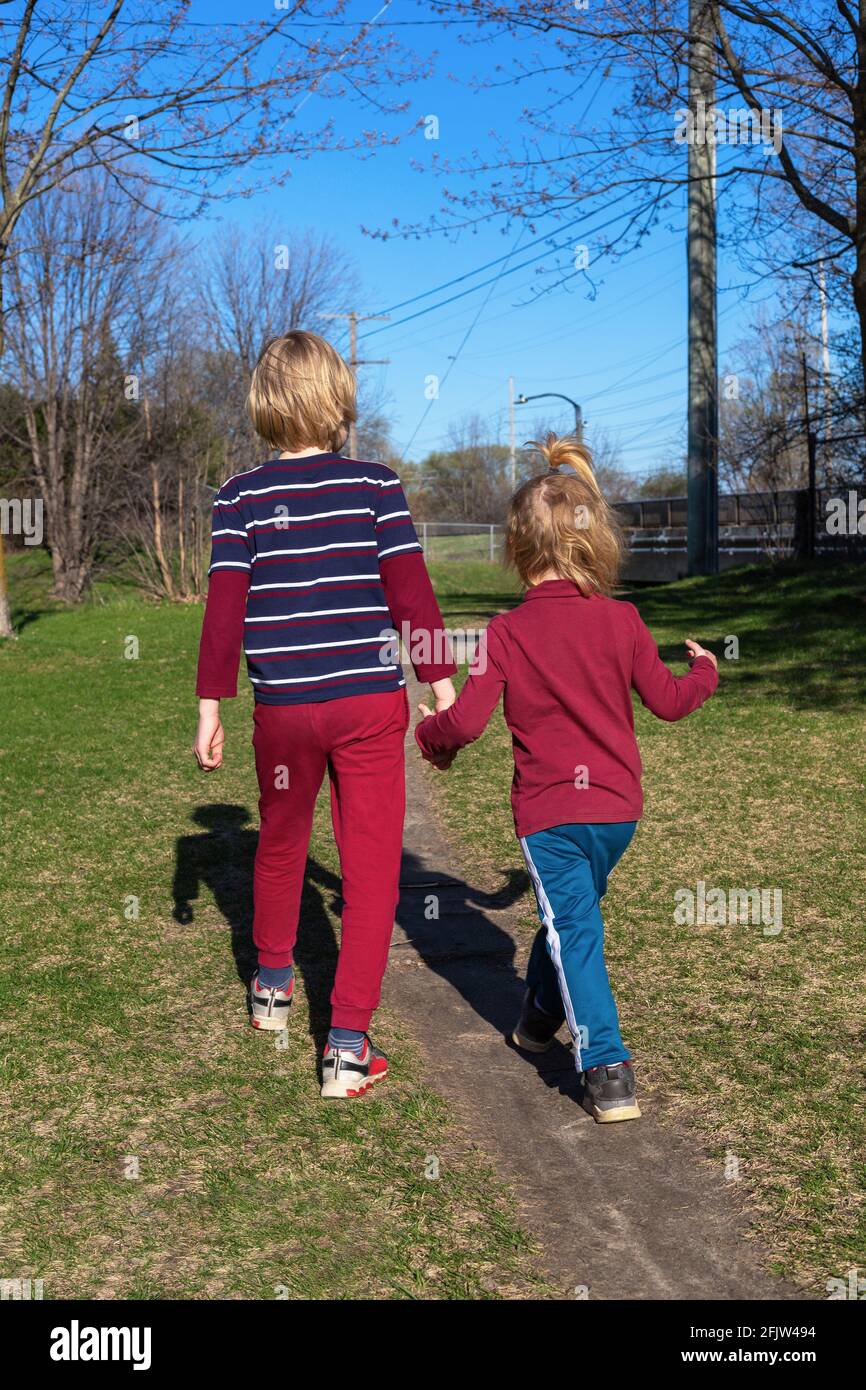 Students Walking In Line Hands Behind Back