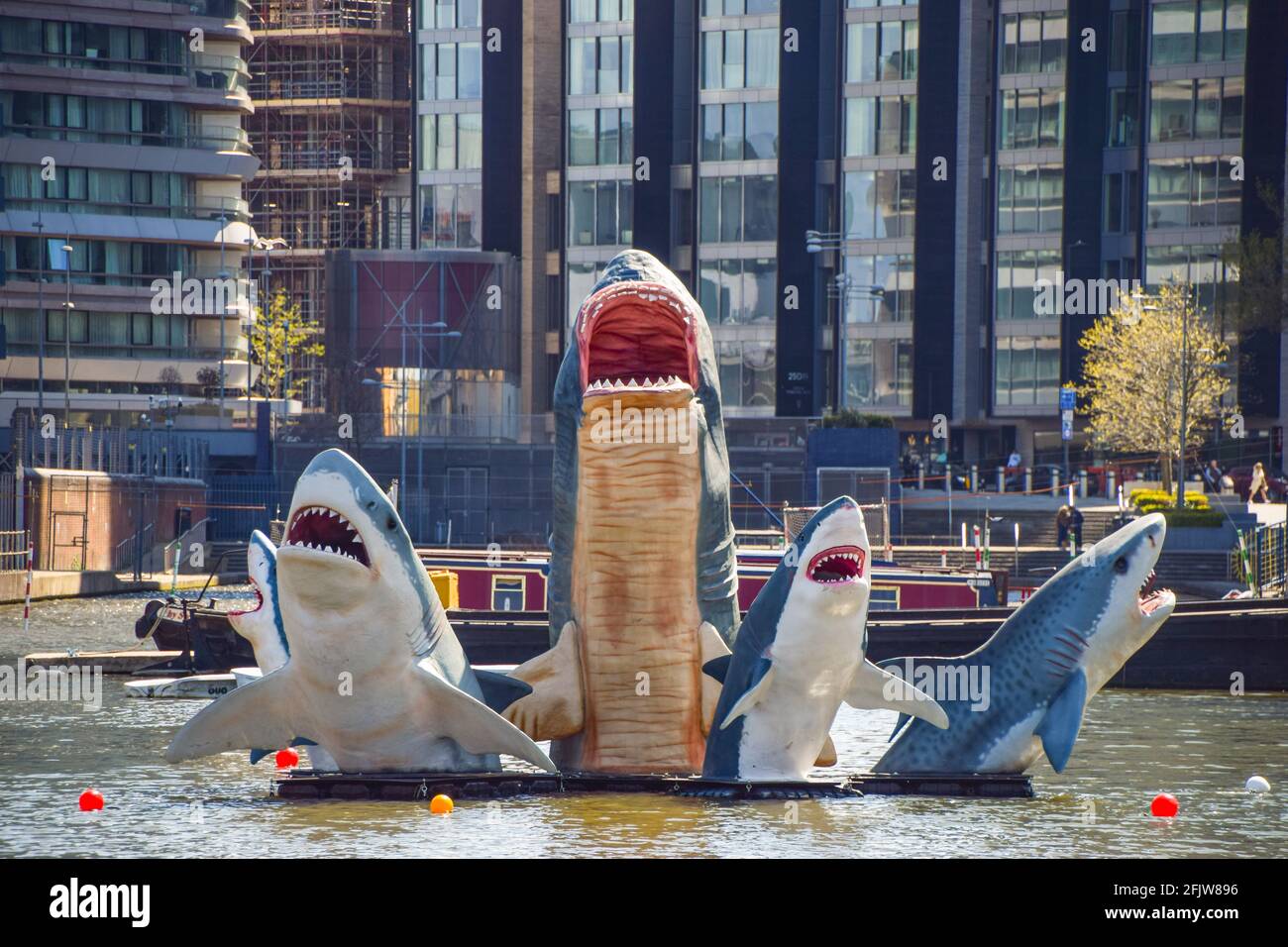 London, UK. 25th Apr, 2021. A view of the sharks art installation in ...