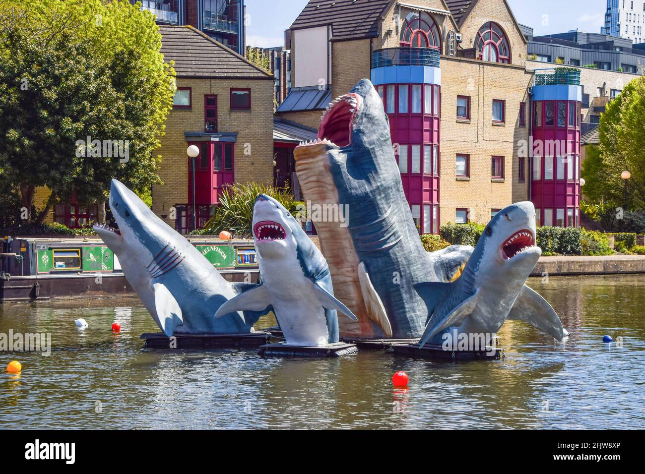 London, UK. 25th Apr, 2021. A view of the sharks art installation in ...