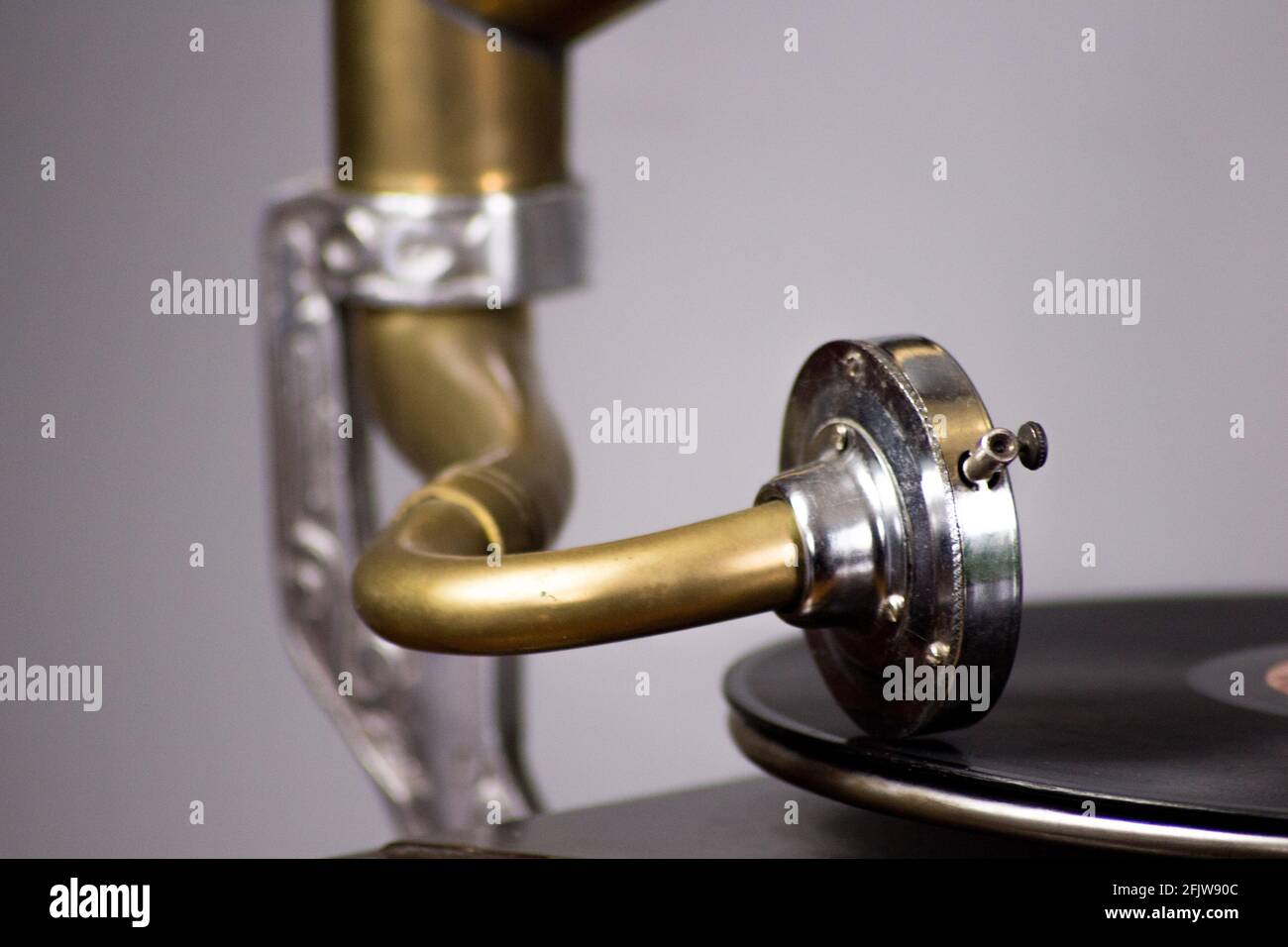 Old gramophone with a plate record. Portable wind-up gramophone ...