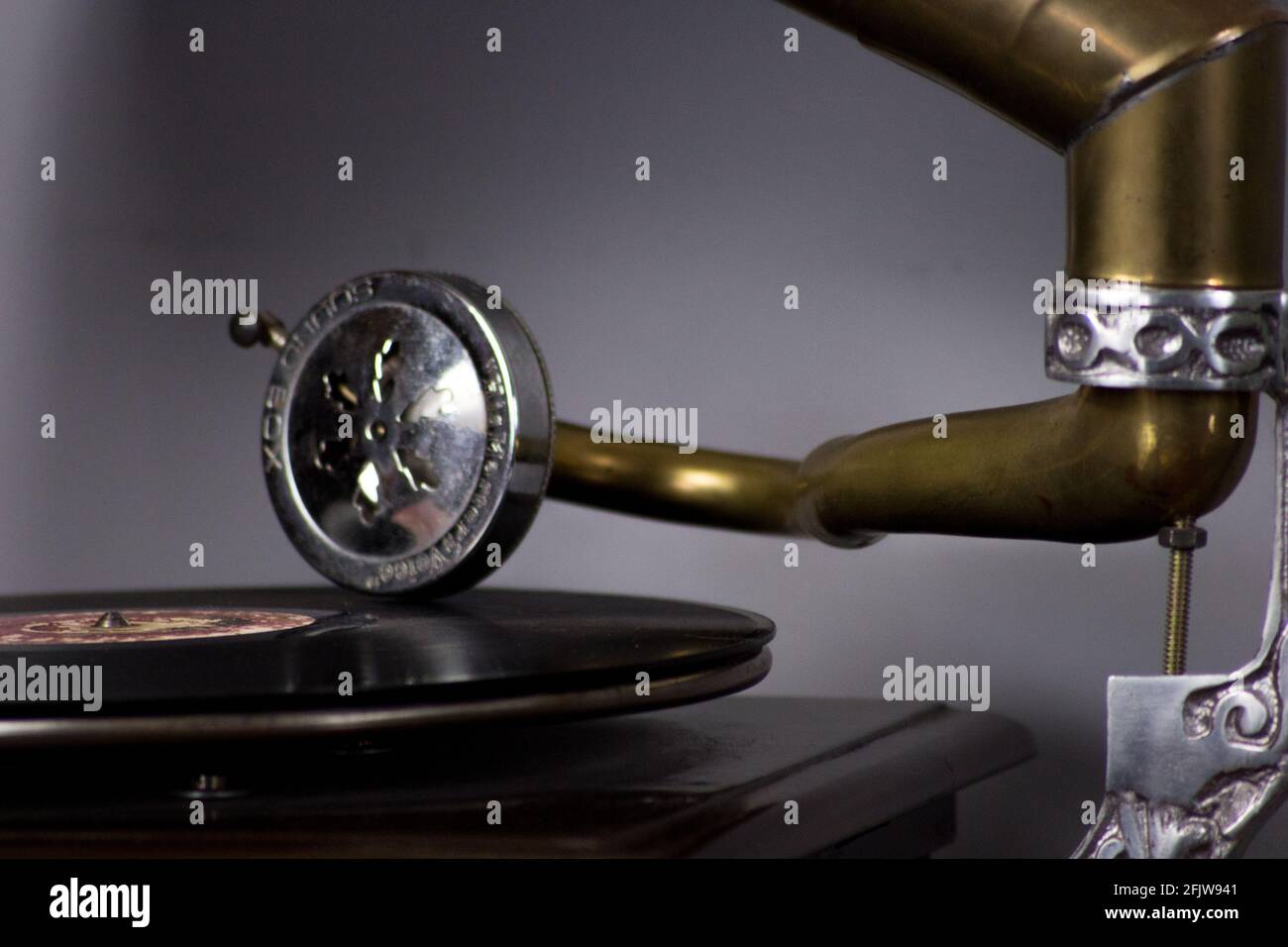 Old gramophone with a plate record. Portable wind-up gramophone ...