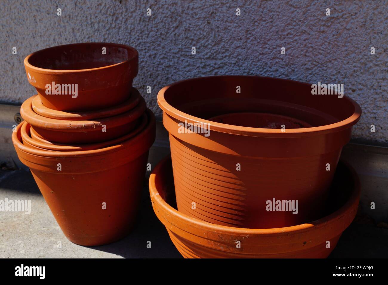 Couple of stacked empty plant pots Stock Photo - Alamy