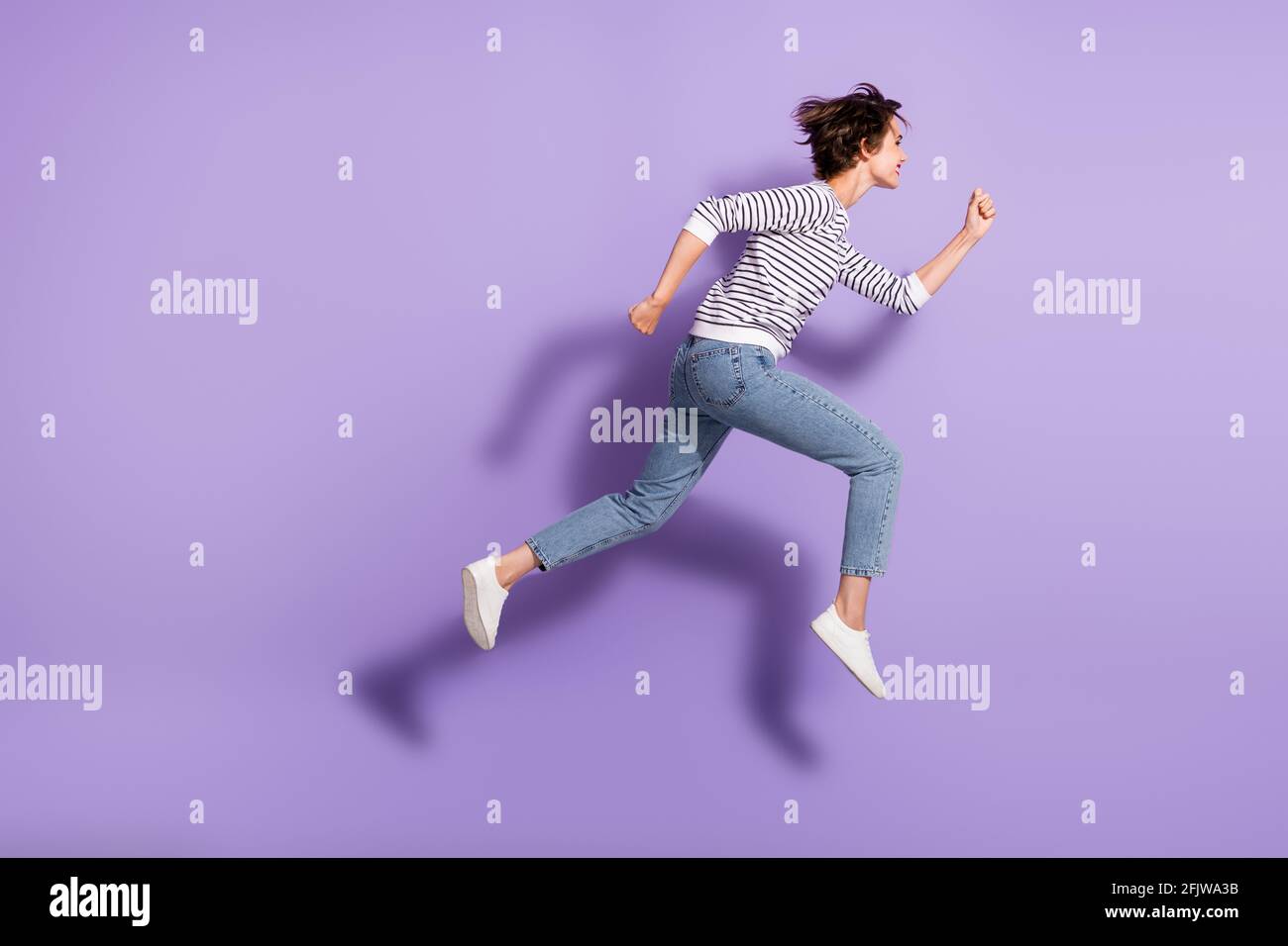 Full length photo of pretty shiny lady dressed casual clothes jumping ...