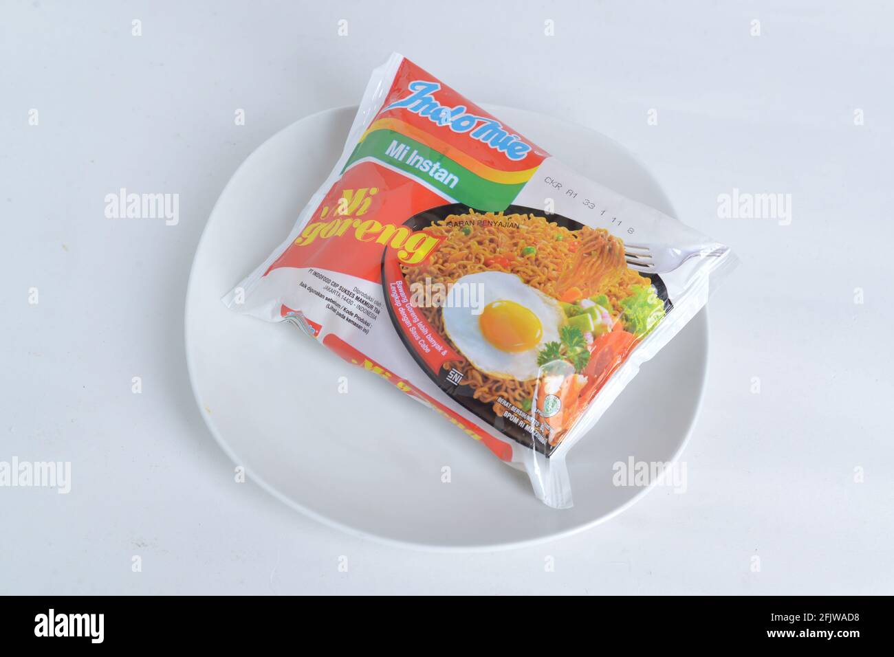 Raw Instant fried Noodles, with packaging brand, Indomie, Mie instant ...