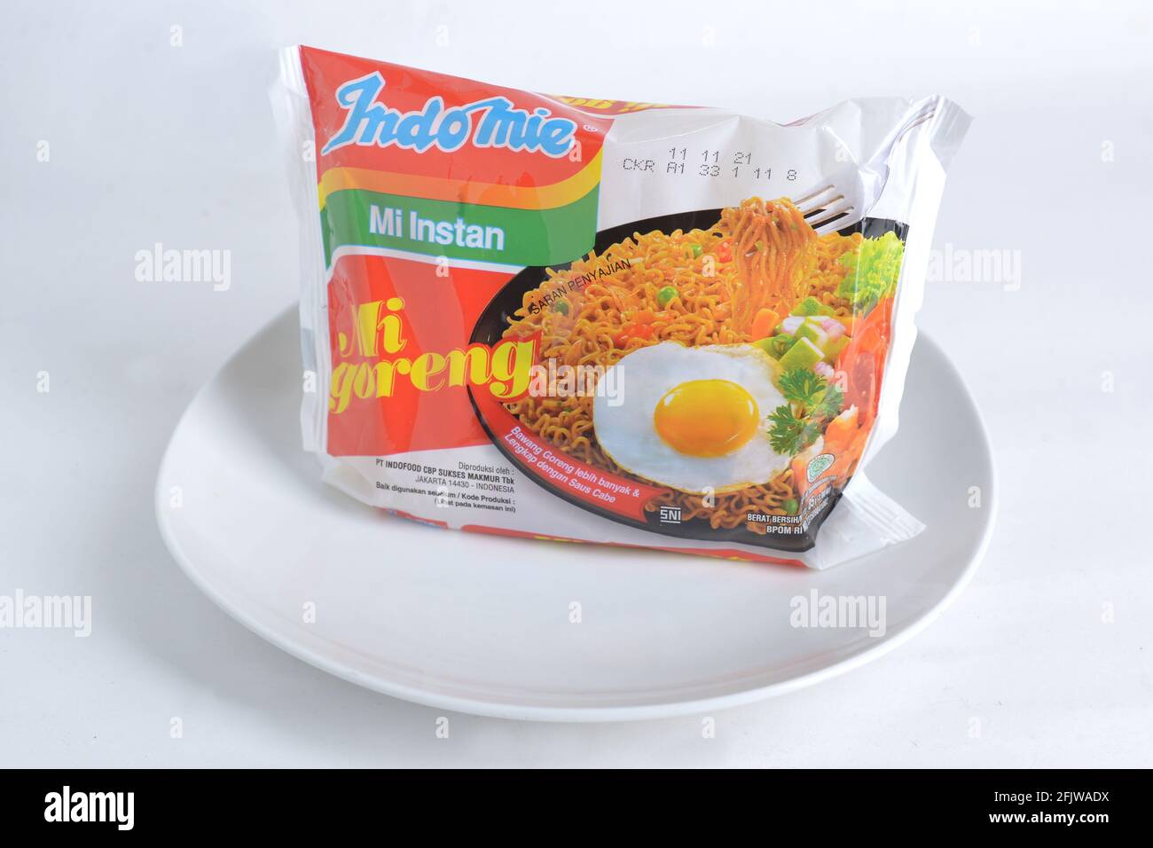 Raw Instant fried Noodles, with packaging brand, Indomie, Mie instant ...