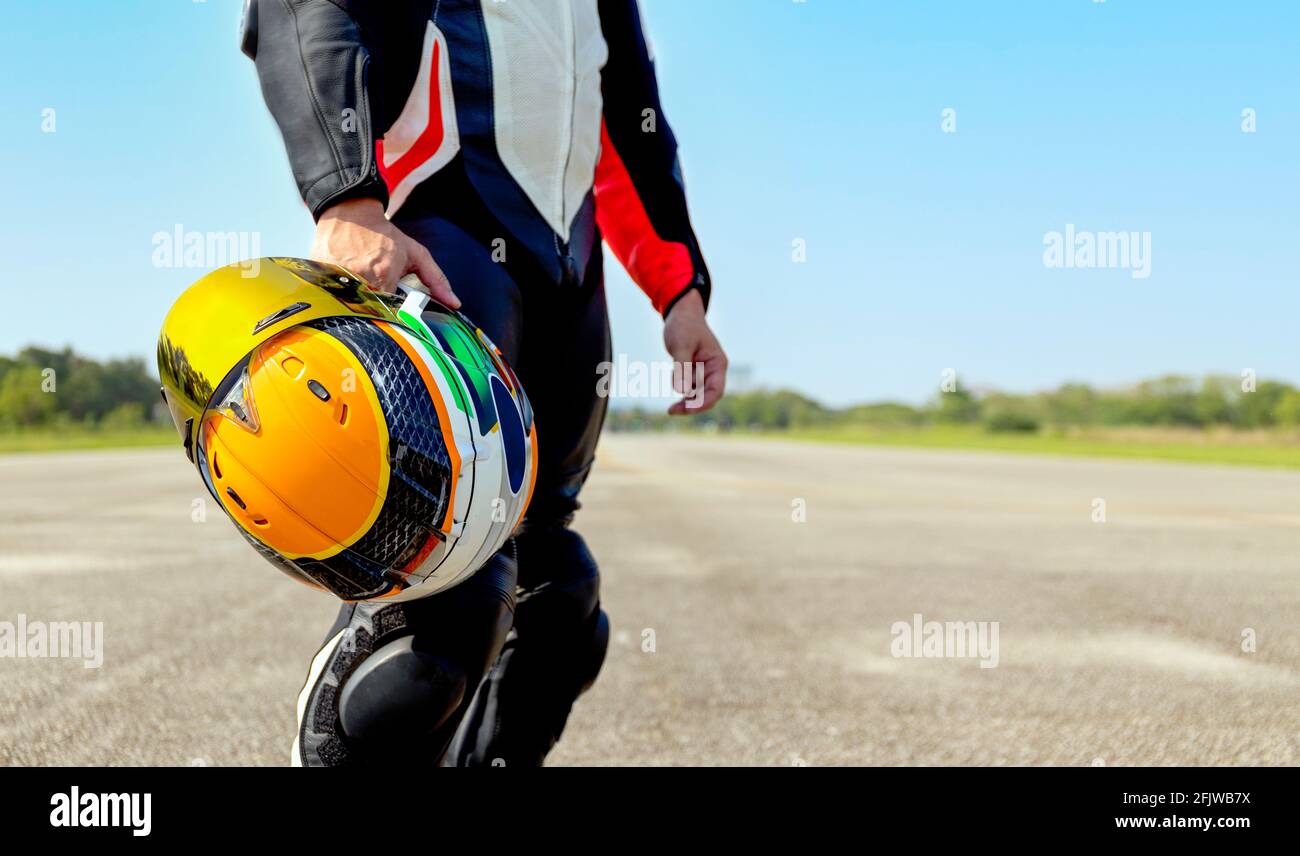 Walking with motorcycle helmet hi-res stock photography and images - Alamy