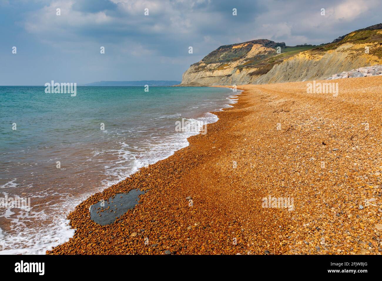 Golden Cap along the shingle beach at Seatown, Dorset, England Stock ...