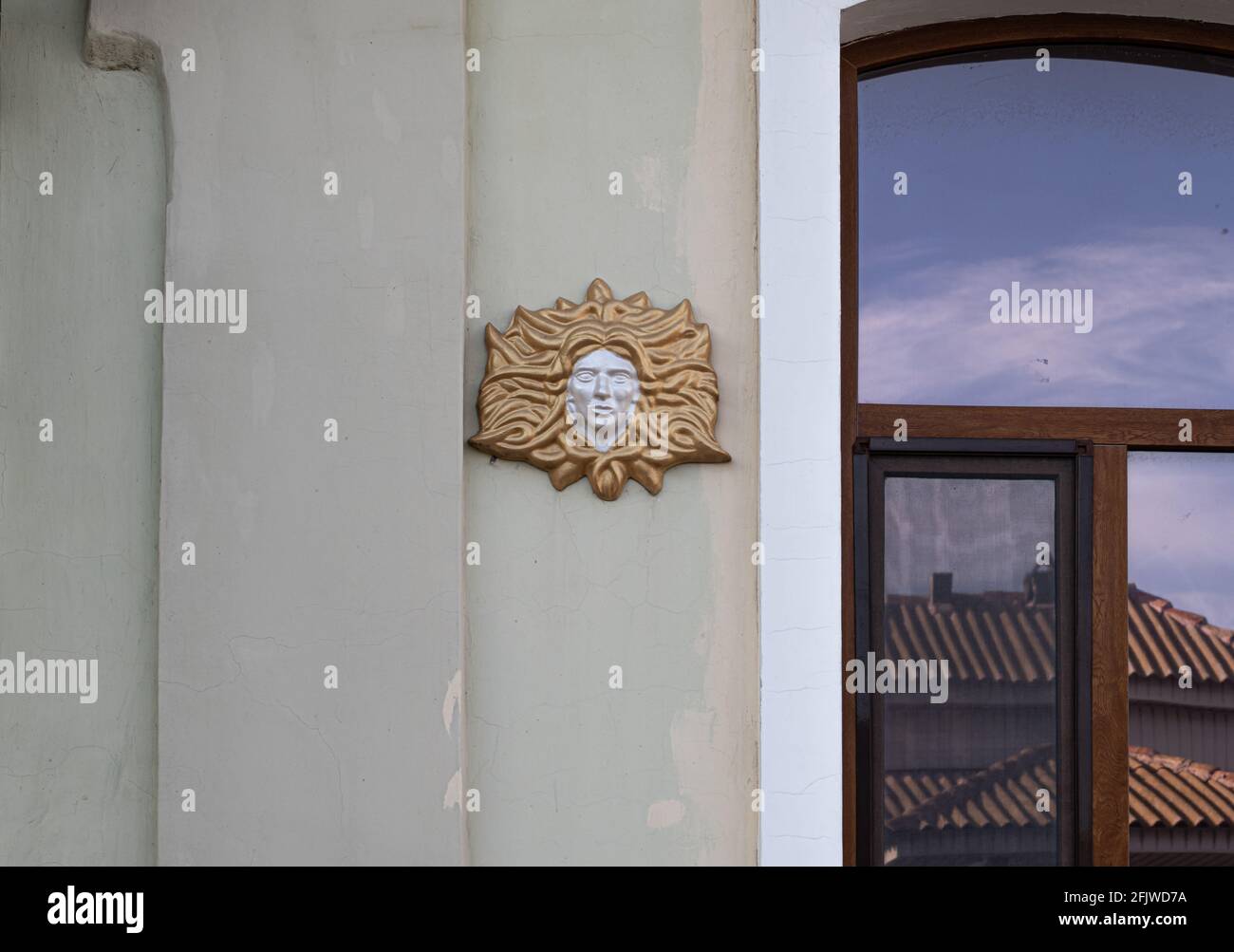 YEVPATORIA, RUSSIA - JUNE, 19, 2020: Bas-relief female face with hair ...
