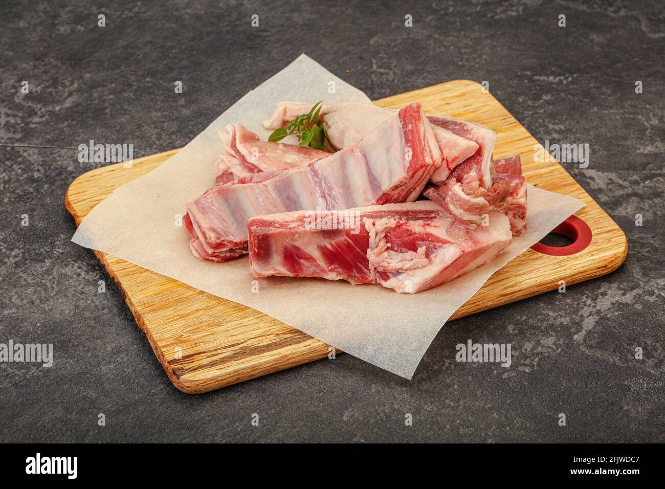 Raw lamb ribs served rosemary for cooking Stock Photo - Alamy