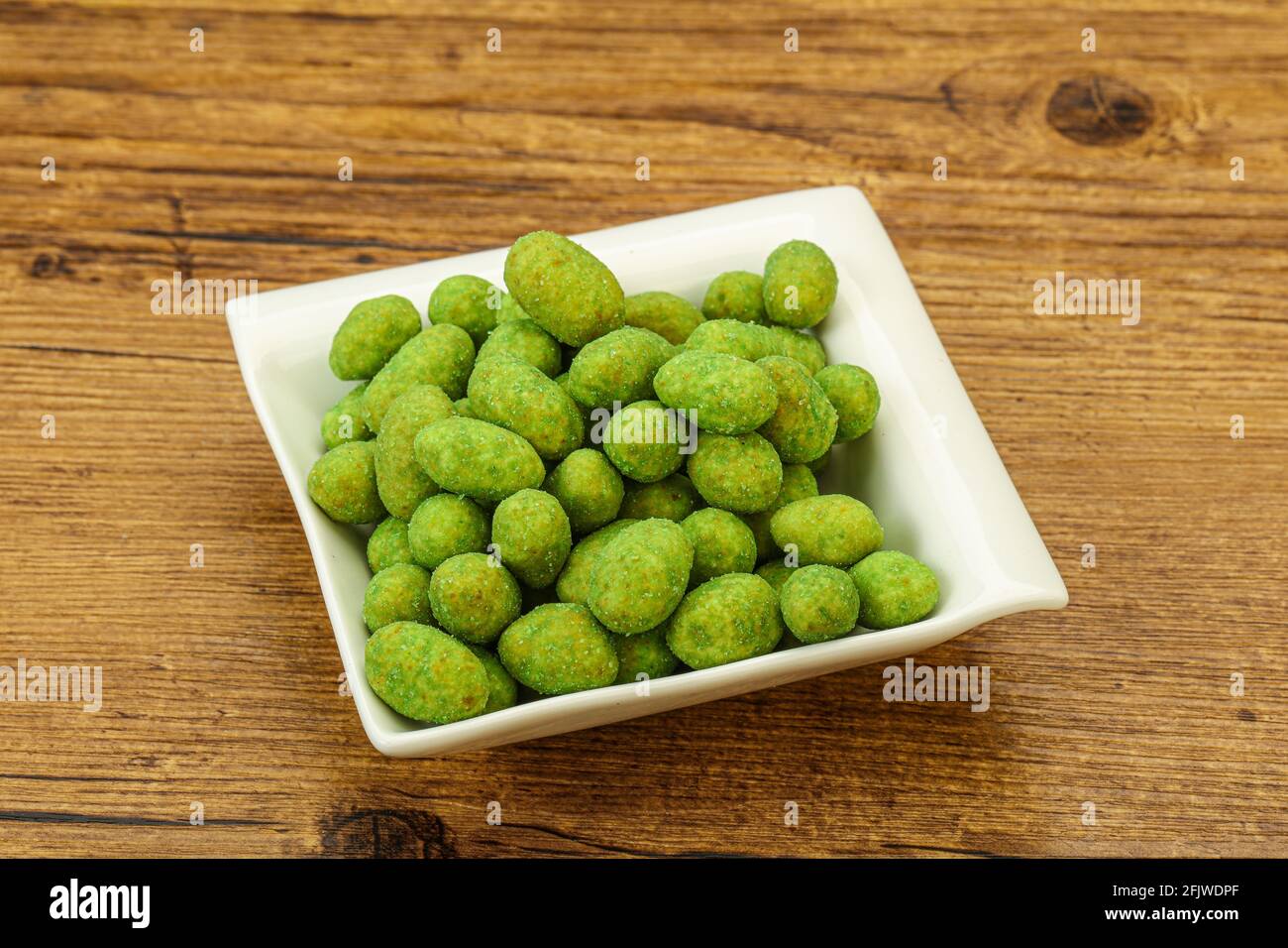 Spicy wasabi peanuts snack in the bowl Stock Photo - Alamy