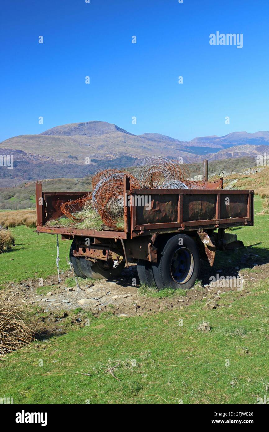 Rusty farm trailer on farmland around Croesor and views of Moel Hebog ...