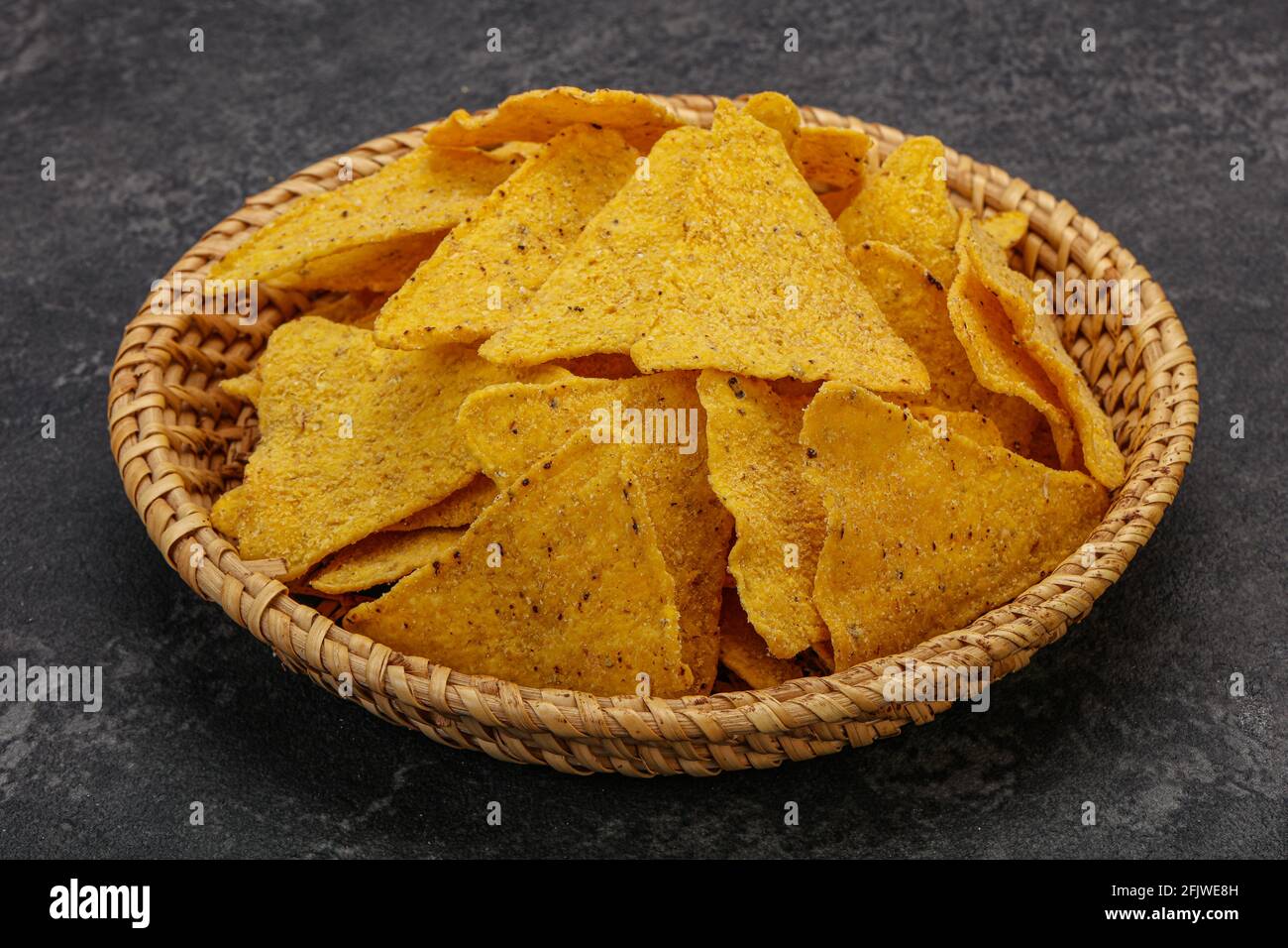Mexican crunchy corn nachos triangle heap Stock Photo - Alamy