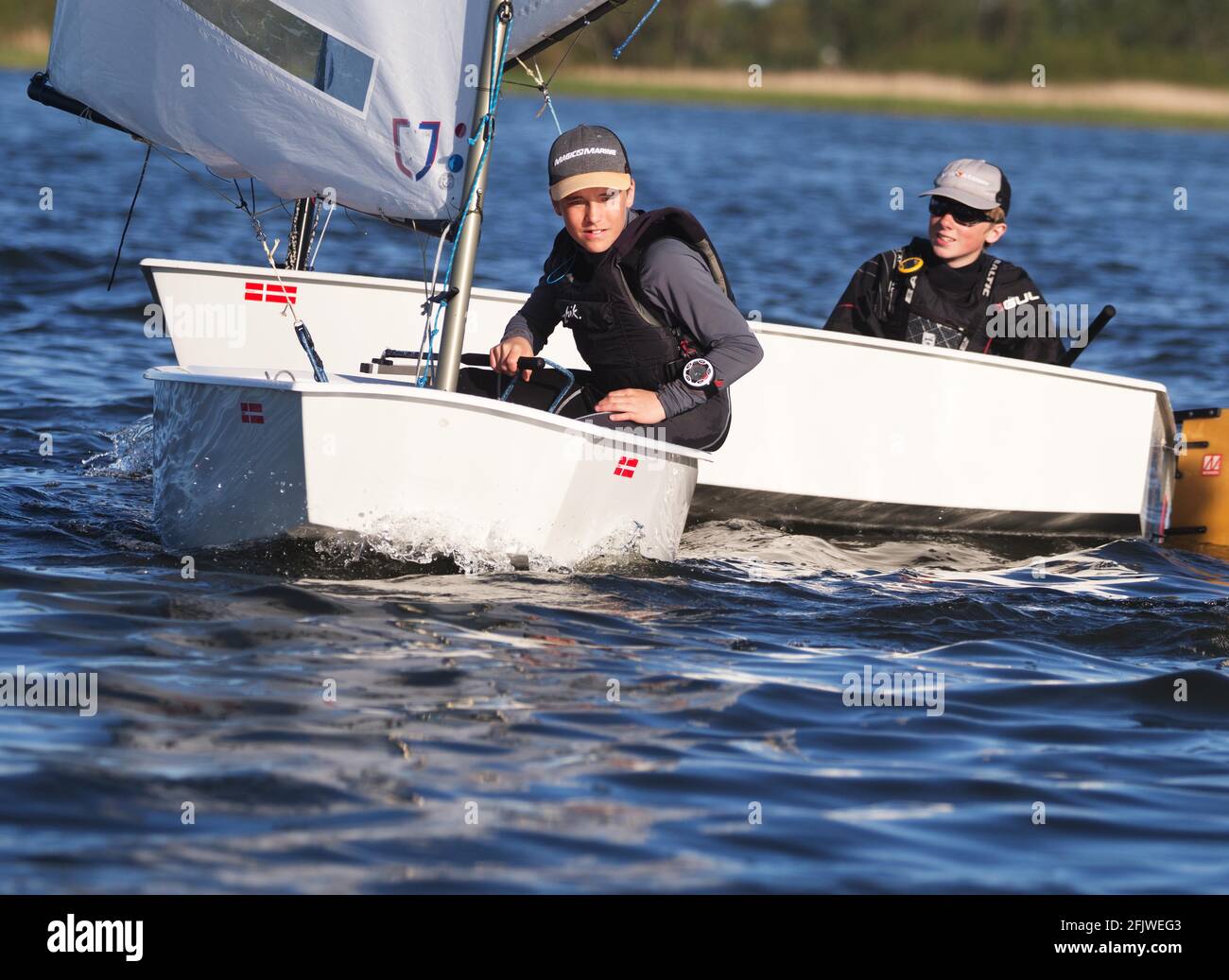 Sailing school with sailors in a dinghy on lake Roxen Stock Photo - Alamy