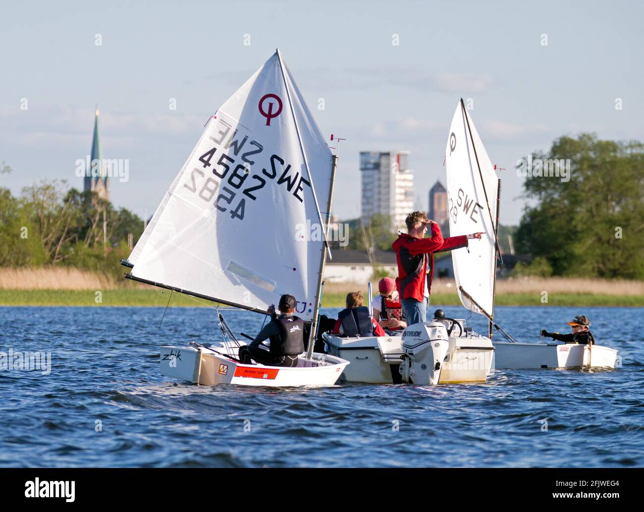 Sailing school with sailors in a dinghy on lake Roxen Stock Photo - Alamy