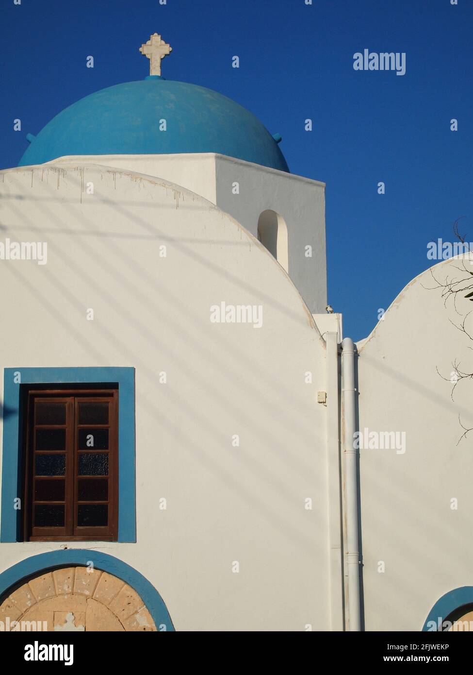 Greek island architecture, under the clear and bright blue summer skies ...