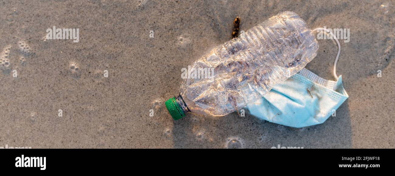 Horizontal banner or header Top view waste on the beach shore. Plastic ...