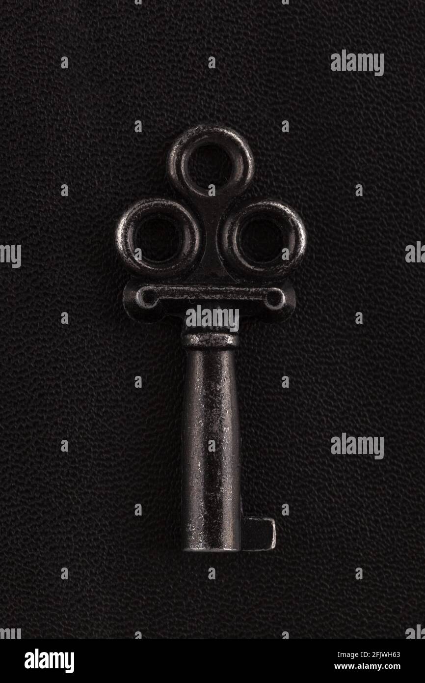 Antique old black vintage key on black background flat lay Stock Photo ...