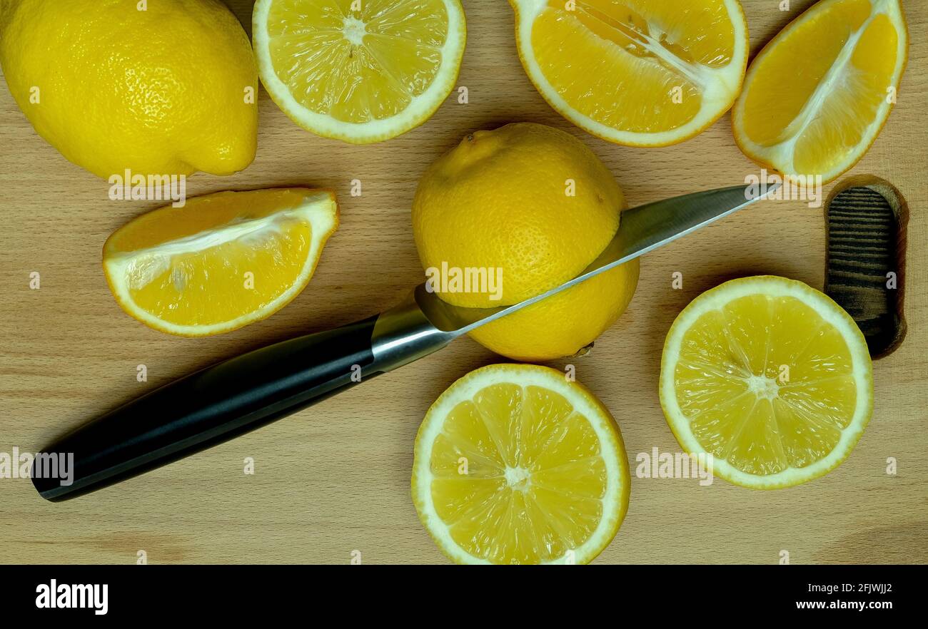 chopped lemons on a knife board Stock Photo - Alamy