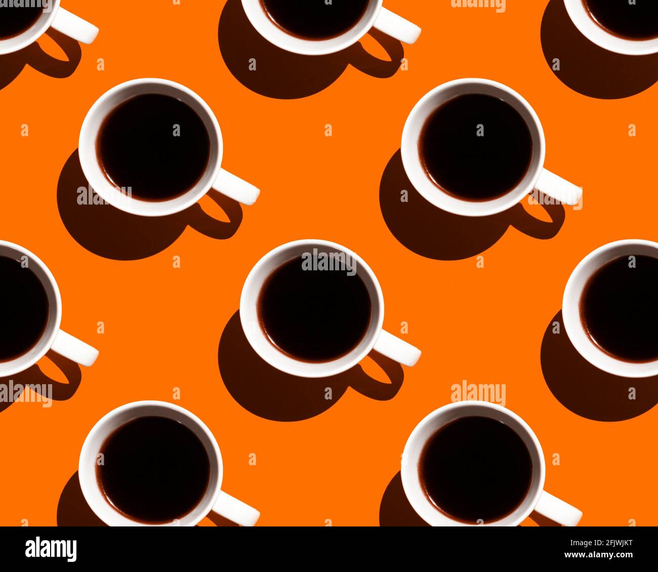Cup of coffee on an orange background, pattern Stock Photo - Alamy