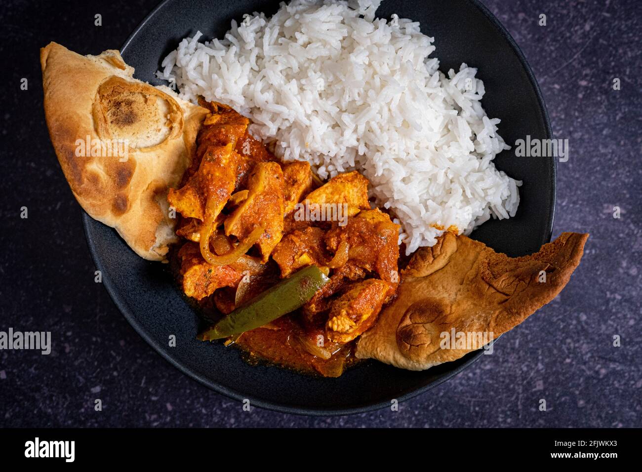 Chicken madras with basmati rice Stock Photo - Alamy