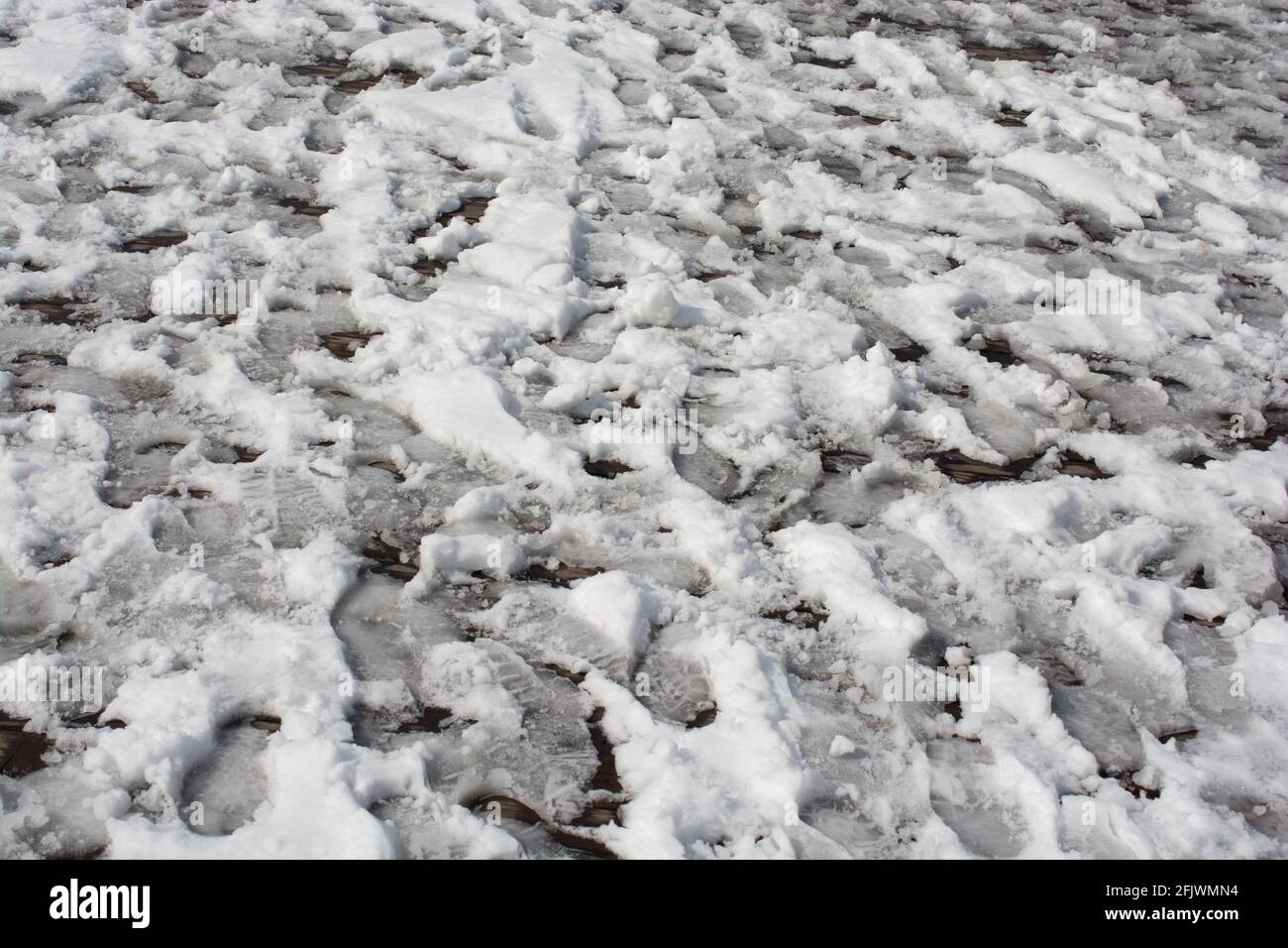 Closeup shot of many footsteps on the snowy ground Stock Photo - Alamy