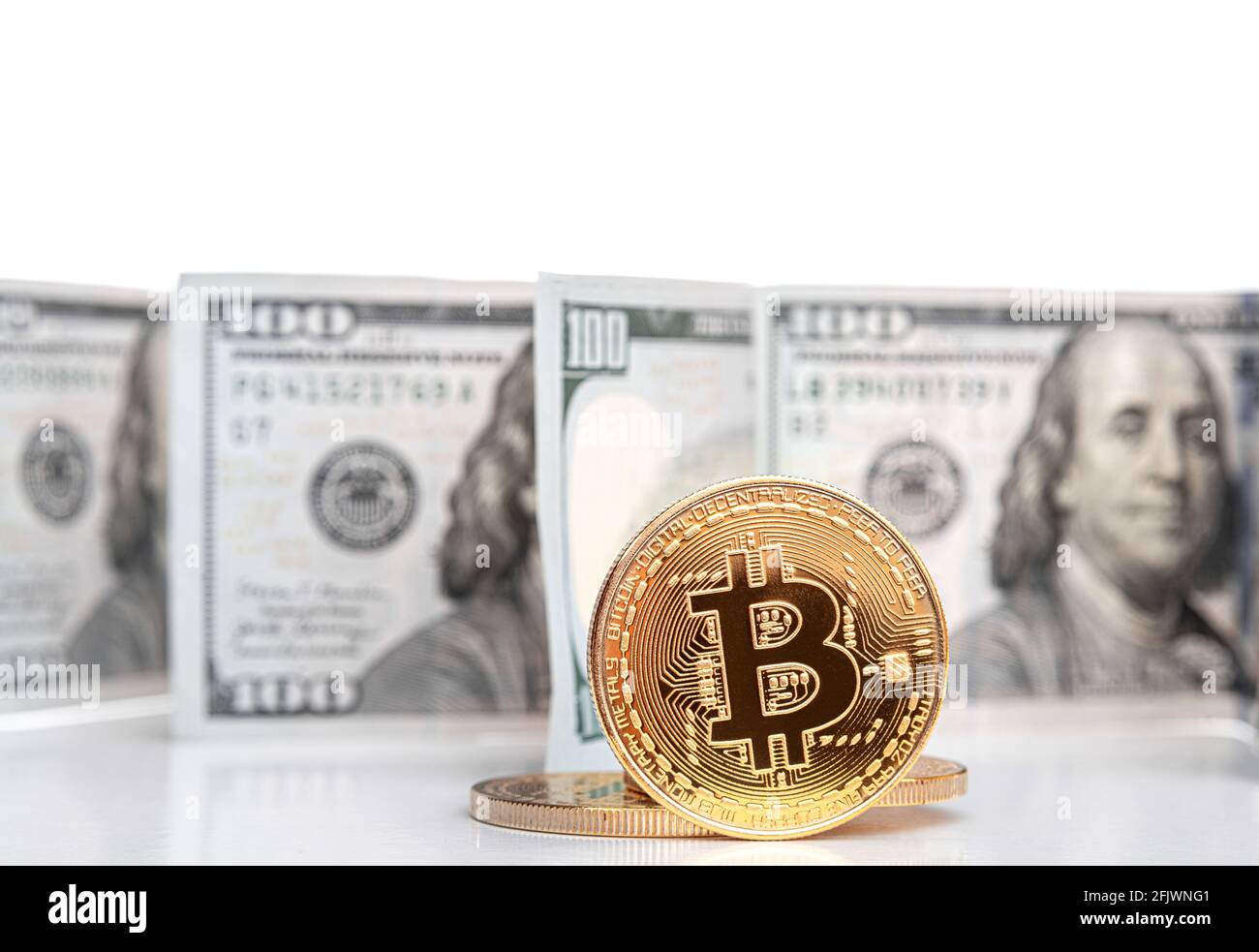 Bitcoin coin on the background of dollar bills Stock Photo - Alamy