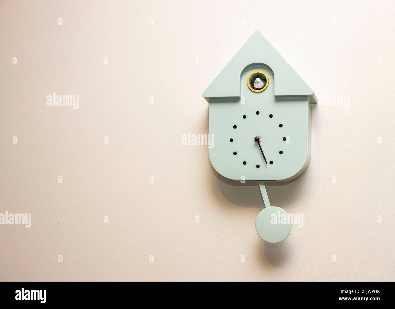 Close up view of grey wall cuckoo clock on background. Sweden Stock ...