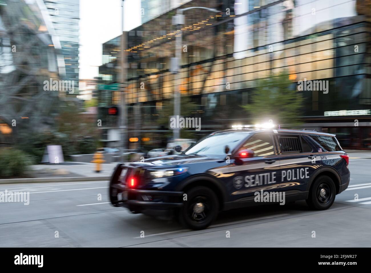 Seattle, USA. 5th Apr, 2021. A police car passing the Amazon campus in ...