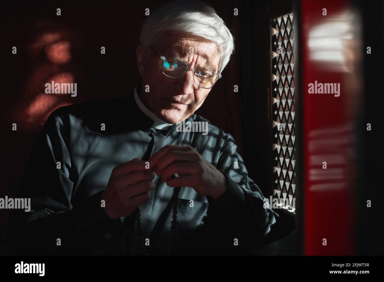Catholic priest confession hi-res stock photography and images - Alamy
