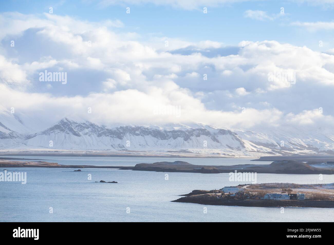 Reykjavik bay, Iceland. Coastal landscape with snowy mountains under ...